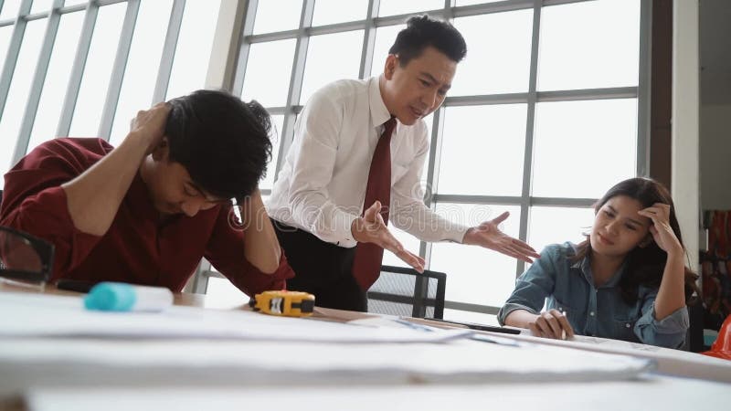 Angry Contractor Boss is Yelling at Construction Team in a Meeting for ...