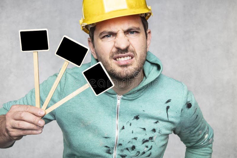 Angry Construction Worker Holding a Blackboard with Space for Text or ...