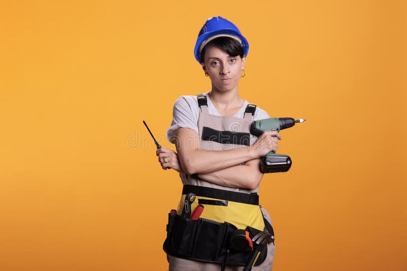 Angry Construction Worker Holding Drill Gun and Screwdriver Stock Photo ...