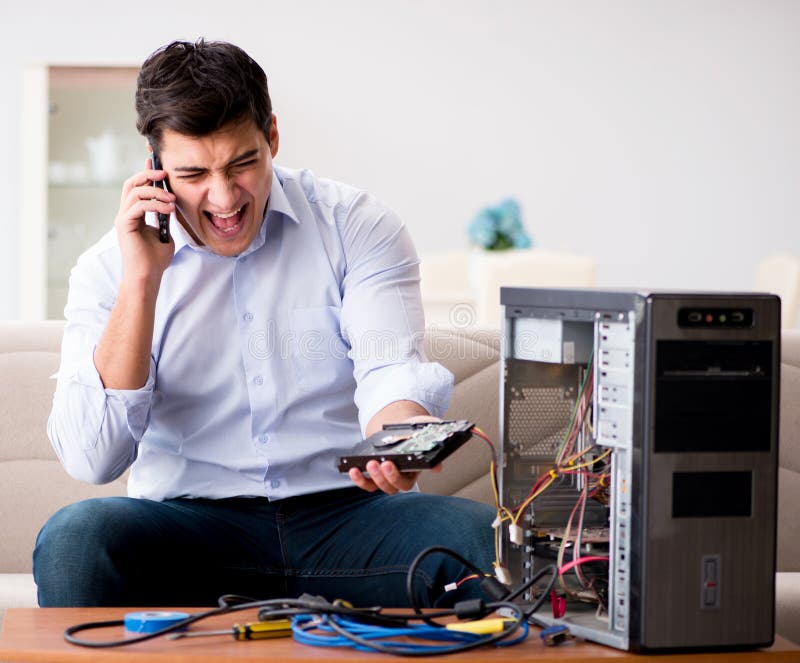Angry Customer Trying To Repair Computer with Phone Support Stock Photo ...