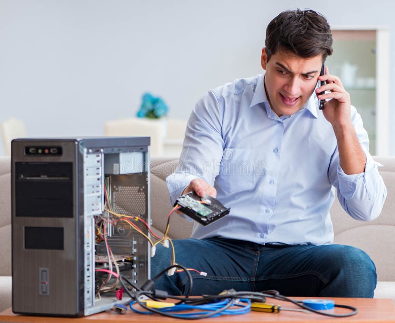 Angry Customer Trying To Repair Computer with Phone Support Stock Photo ...