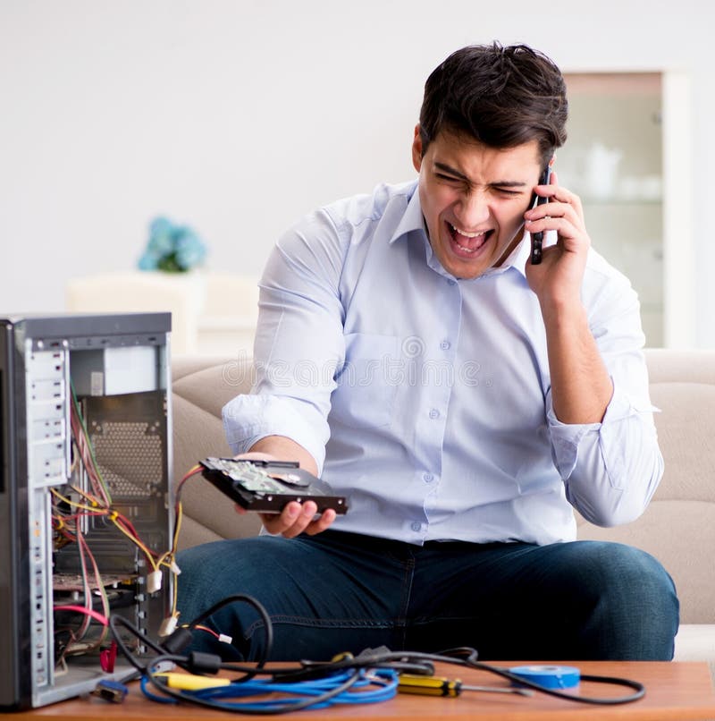 Angry Customer Trying To Repair Computer with Phone Support Stock Photo ...