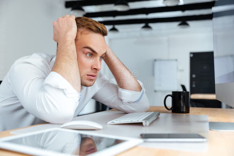 Angry Desperate Young Businessman Sitting at the Table Stock Image ...