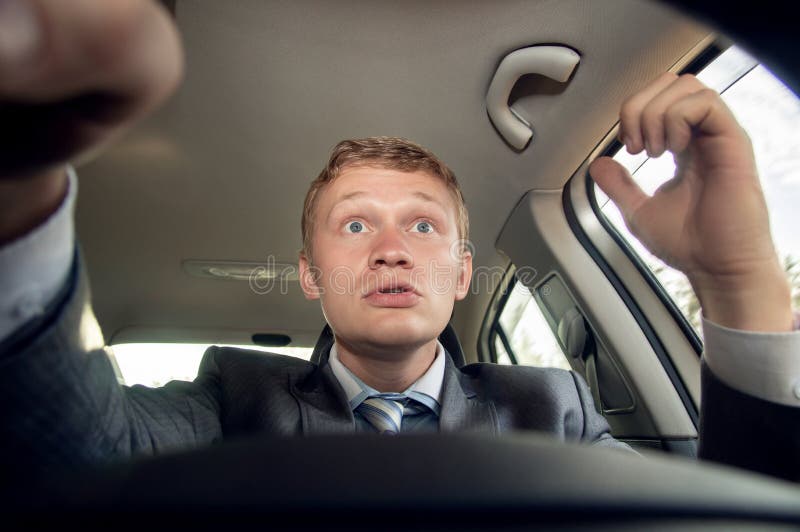 Angry Driver Behind the Wheel of a Car while Driving Stock Image ...