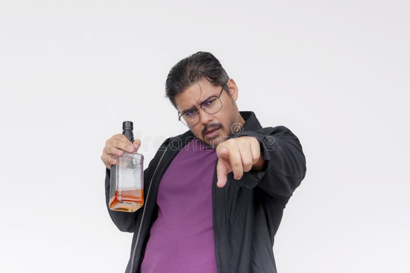 An Angry Drunk Man Calls Out and Confronts Someone, while Holding a ...