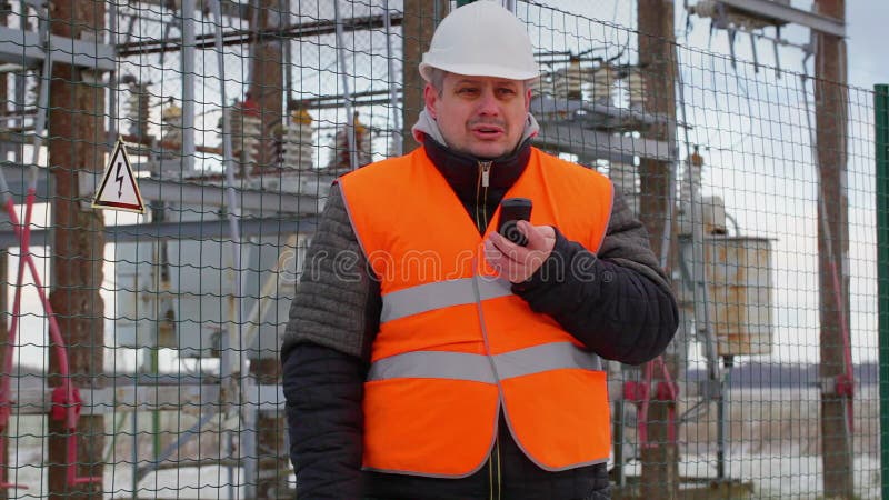 Angry Electrical Engineer Talking on Cell Phone in Substation Stock ...