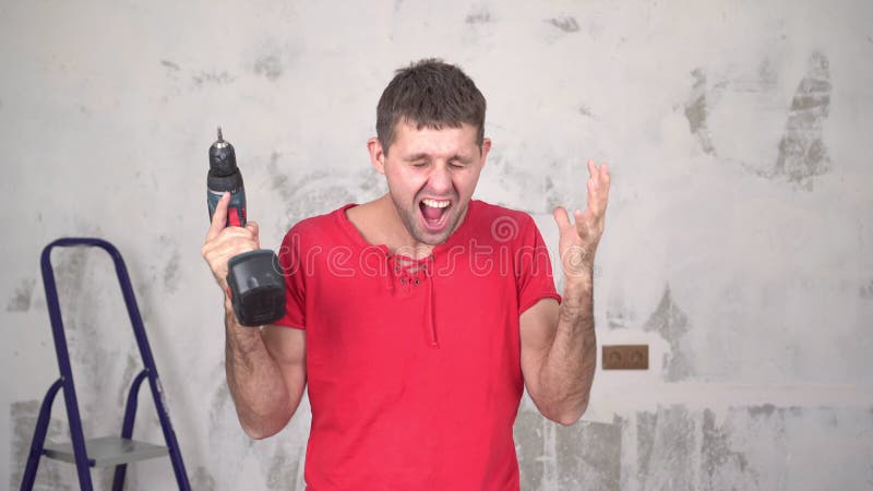 Angry, Emotional Man in a Panic while Renovating a House Stock Video ...
