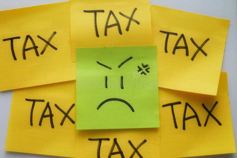 Angry Face on Green Note Surrounded by Yellow Tax Notes Stock Photo ...