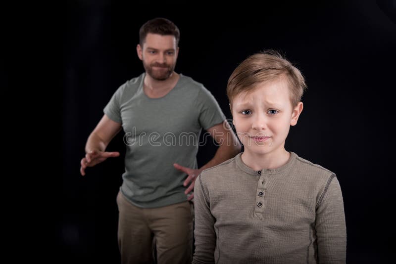 Angry Father Gesturing and Looking at Scared Son Stock Photo - Image of ...