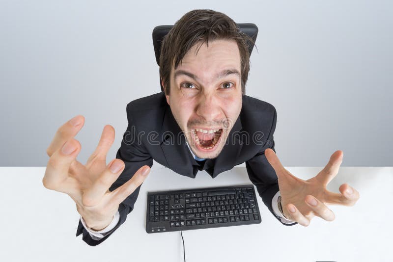 Angry and Frustrated Man is Working with Computer and Shouting Stock ...