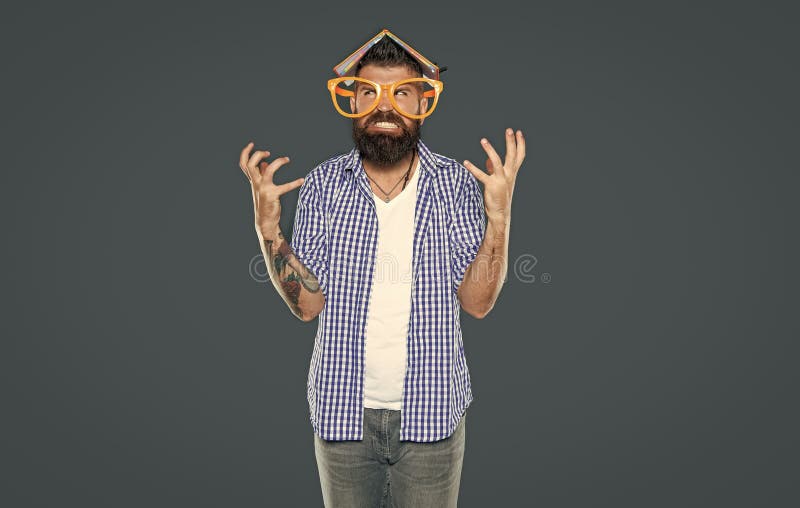 Angry Funny Bearded Man in Party Glasses with Book on Head Stock Photo ...