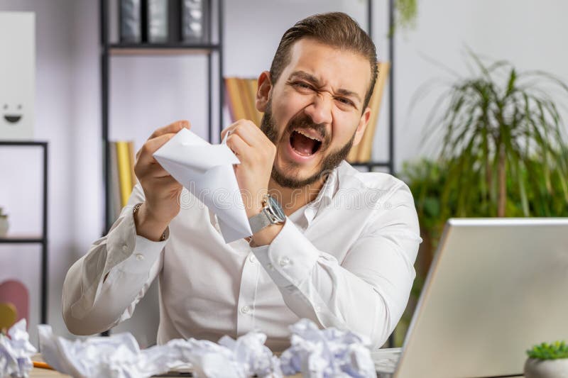 Angry Furious Man Working at Home Office Throwing Crumpled Paper ... Angry Furious Man Working at Home Office Throwing Crumpled Paper ...