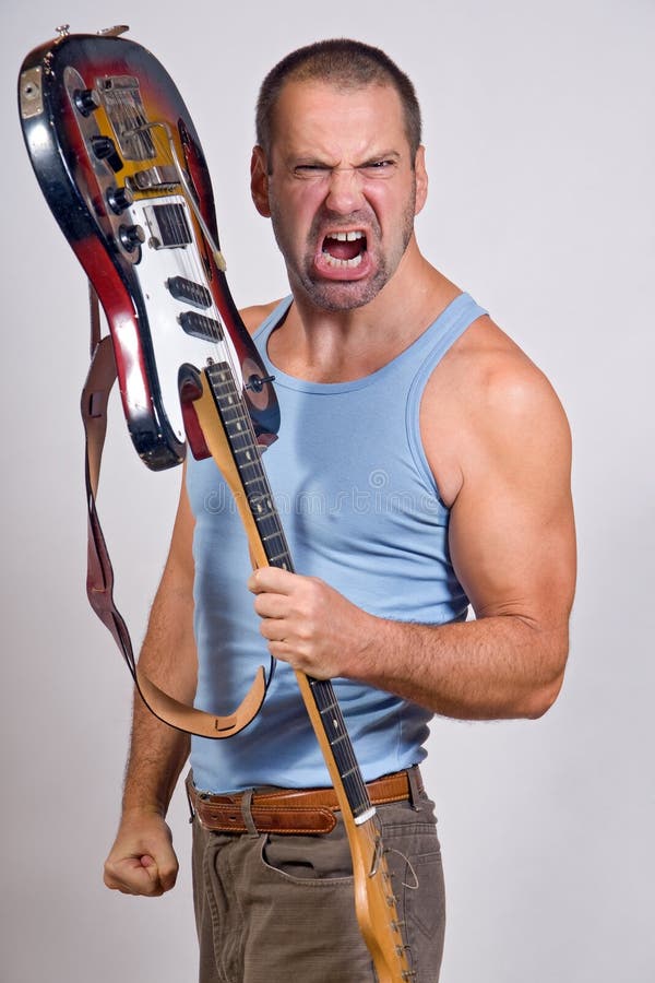 Angry guitarist stock image. Image of muscles, emotion - 23591625