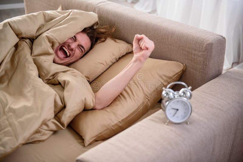Angry Guy Screaming at the Alarm Clock at Home Stock Photo - Image of ...