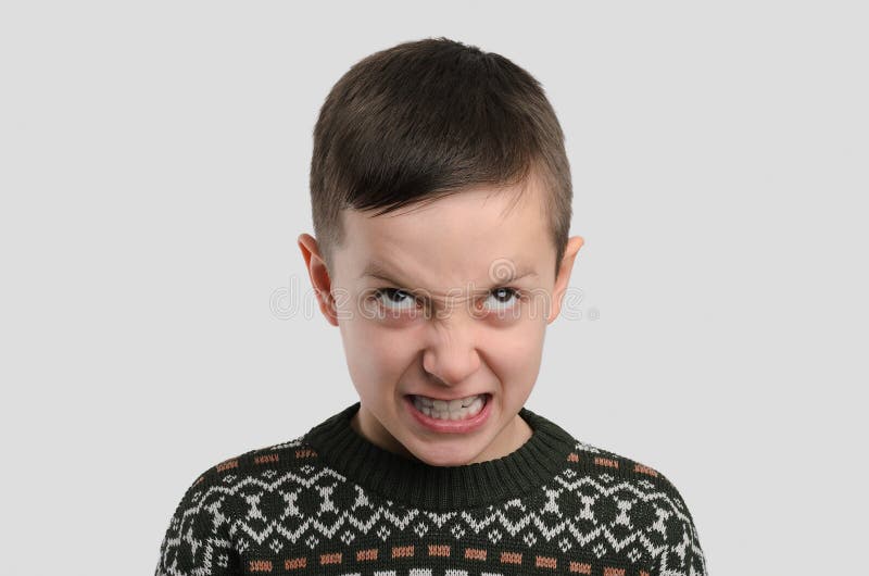 An Angry Little Boy Looking Up. Expression of Emotions Stock Photo ...