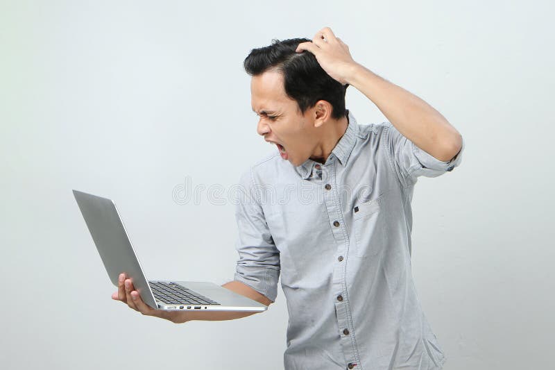 Angry Mad Asian Man Holding Laptop Computer on Isolated Background ...