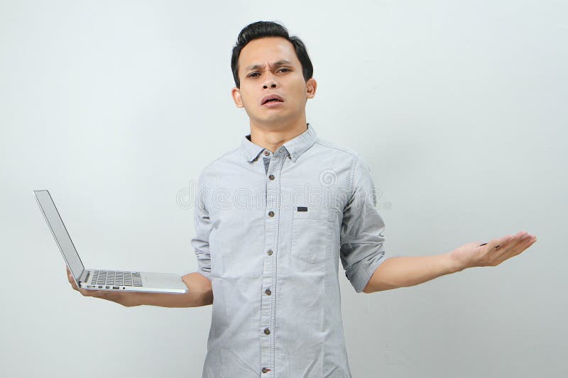 Angry Mad Asian Man Holding Laptop Computer on Isolated Background ...