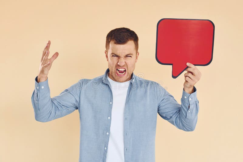 Angry and Mad. Man Standing in the Studio with Empty Signs for the Text ...