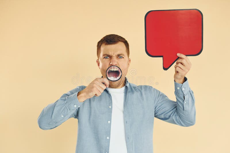 Angry and Mad. Man Standing in the Studio with Empty Signs for the Text ...
