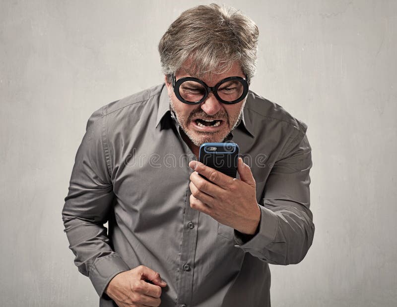 Angry Man with cellphone stock photo. Image of male, electronics - 88012102