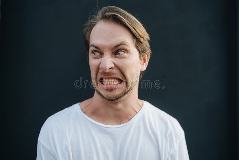 Angry Man Clenched His Teeth in Anger at Dark Wall Stock Photo - Image ...