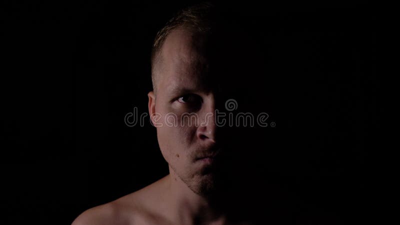 Angry Man in the Dark. only Half of the Face is Highlighted Stock ...