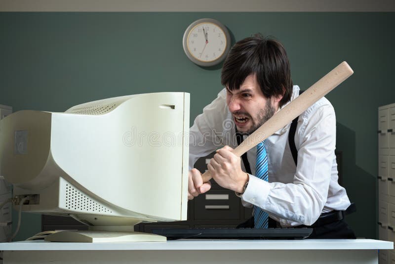 Angry Man is Destroying Old Computer with Baseball Bat in Office. Stock ...