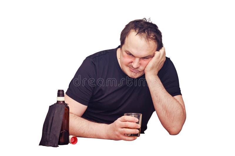 Angry Man Drinks Alcohol Sitting with a Bottle of Whiskey at the ...