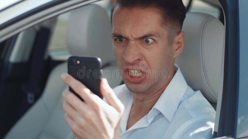 Angry Man Using Smartphone. Man is Angry with the Message that he Read ...
