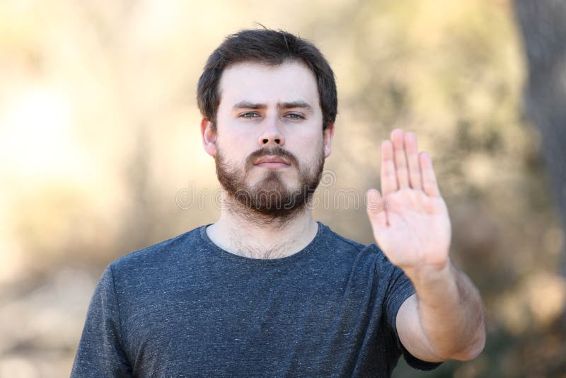 Angry Man Gesturing Stop with Hand Outdoors Stock Photo - Image of ...