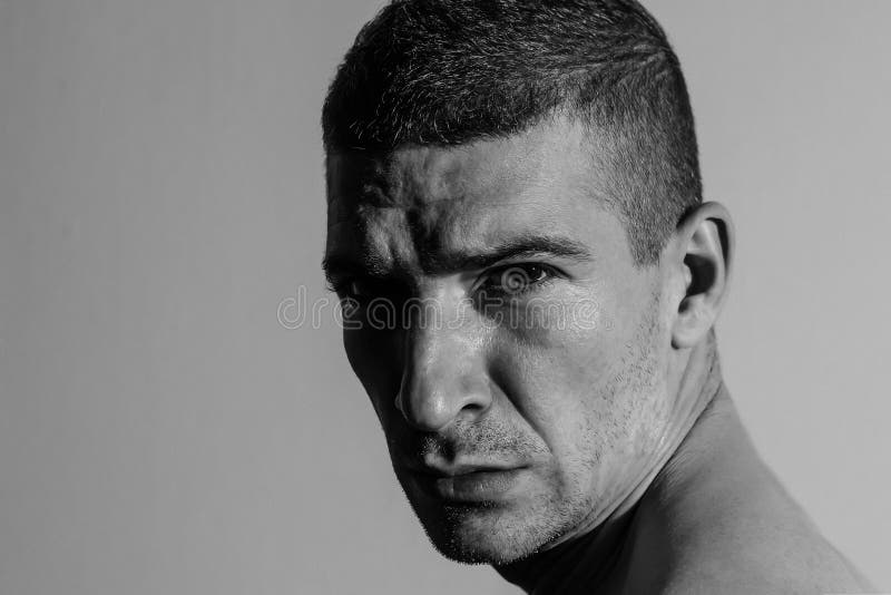 Dark Fashion Portrait of Young Angry Man with Contrast Shadows. Stock ...