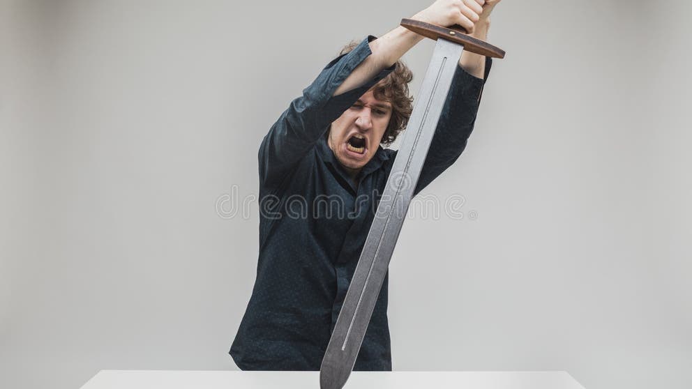 Angry Man Hitting His Desk with a Sword Stock Image - Image of ...
