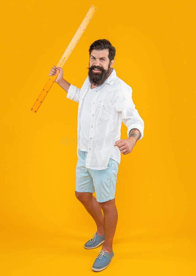 Angry Man with Measuring Ruler Isolated on Yellow. Man with Measuring ...