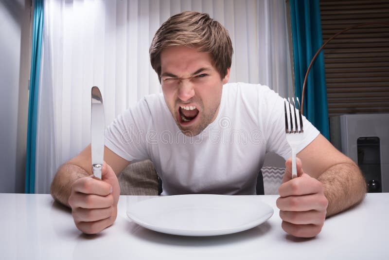 Angry Man Holding Knife and Fork Stock Image - Image of lifestyle, loss ...