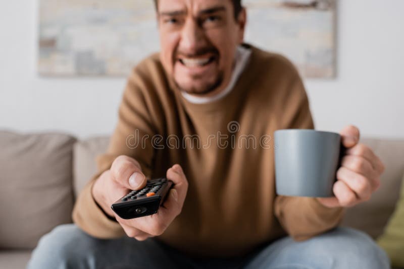 Angry Man Holding Remote Controller and Stock Image - Image of casual ...