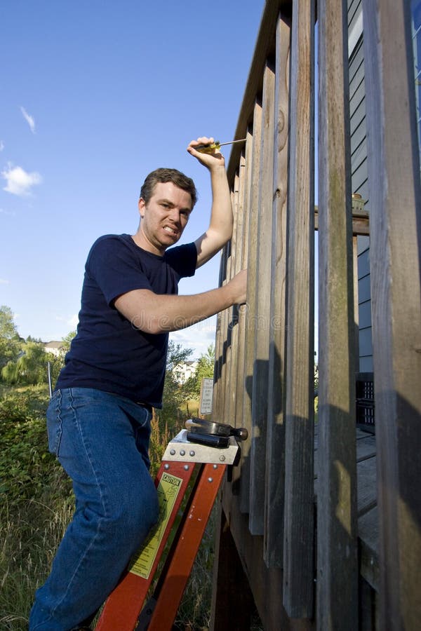 Angry Man On Ladder - Vertical Picture. Image: 6202092