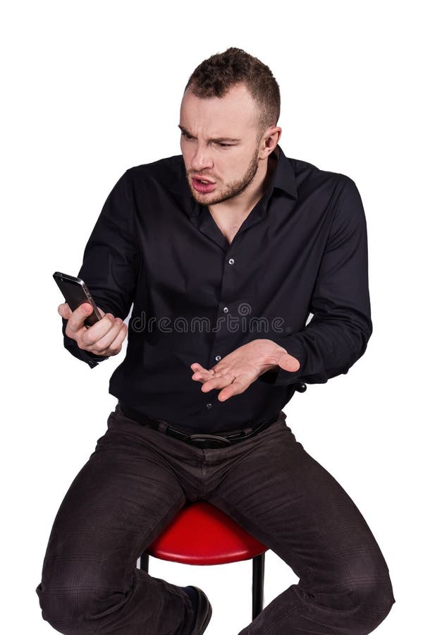 Angry Man Looking at His Mobile Phone with a Furious Expression Stock ...