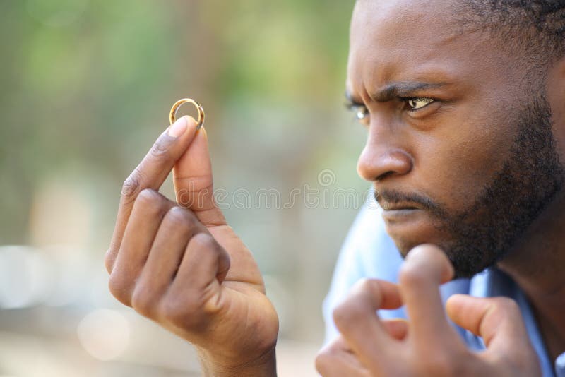 Angry Man Looking at Wedding Ring Stock Photo - Image of african ...