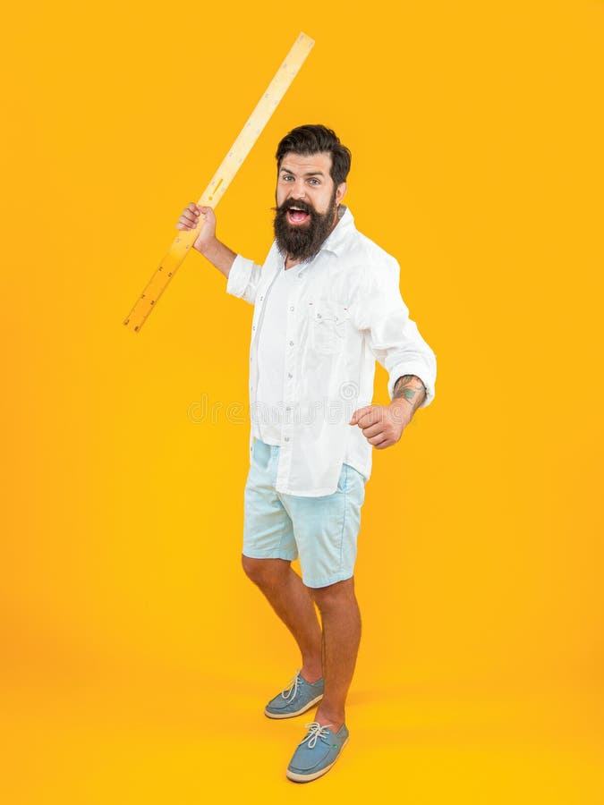 Angry Man with Measuring Ruler Isolated on Yellow. Man with Measuring ...