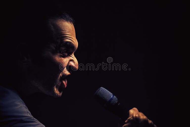 Angry Man with Microphone stock photo. Image of action - 79014980