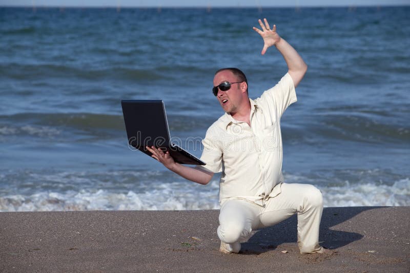 2+ Angry man punching laptop beach Free Stock Photos - StockFreeImages