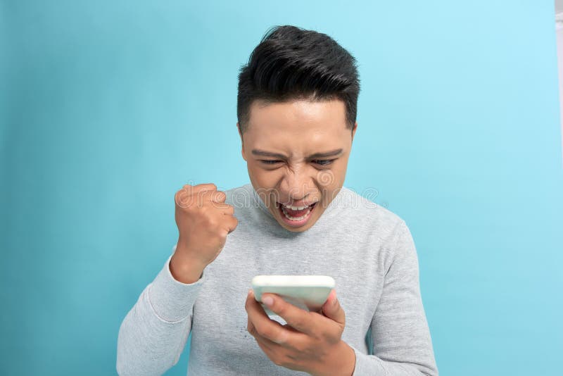 Angry Man Screaming on the Phone Isolated on a Blue Background Stock ...