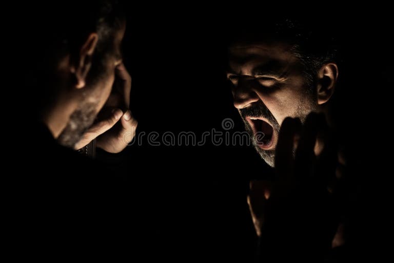 Angry Man Shouting in Front of Mirror at His Reflection Stock Photo ...