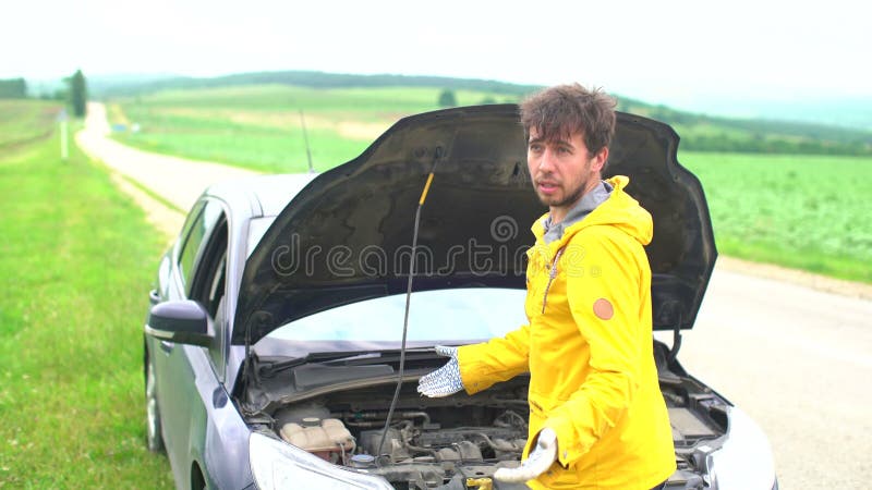 Angry Man Swears and Try To Fix a Broken Car Stock Footage - Video of ...