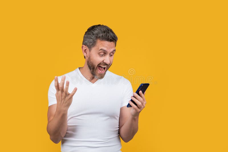 Angry Man Talk on Smartphone Isolated on Yellow. Man Talk on Smartphone ...