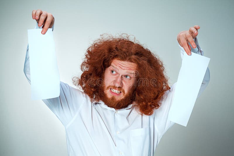 Angry man tear out paper stock image. Image of attractive - 73676739