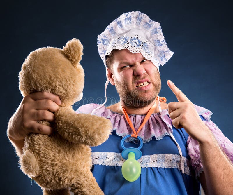 Angry man with toy bear stock image. Image of concept - 38547083
