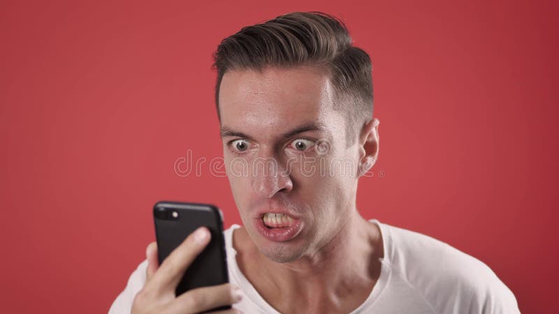 Angry Man Using Mobile Phone at Home. Frustrated Entrepreneur is Angry ...