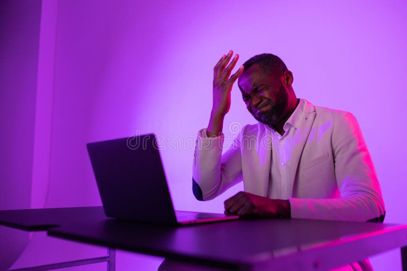 Angry Man at Work. Angry African American Worker Looking at Laptop ...