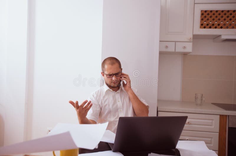 Angry Man Working and Talking on His Phone at Home Stock Image - Image ...